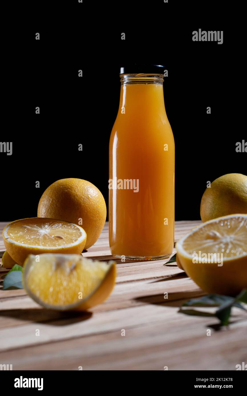 Orange juice bottle with sliced oranges Stock Photo - Alamy