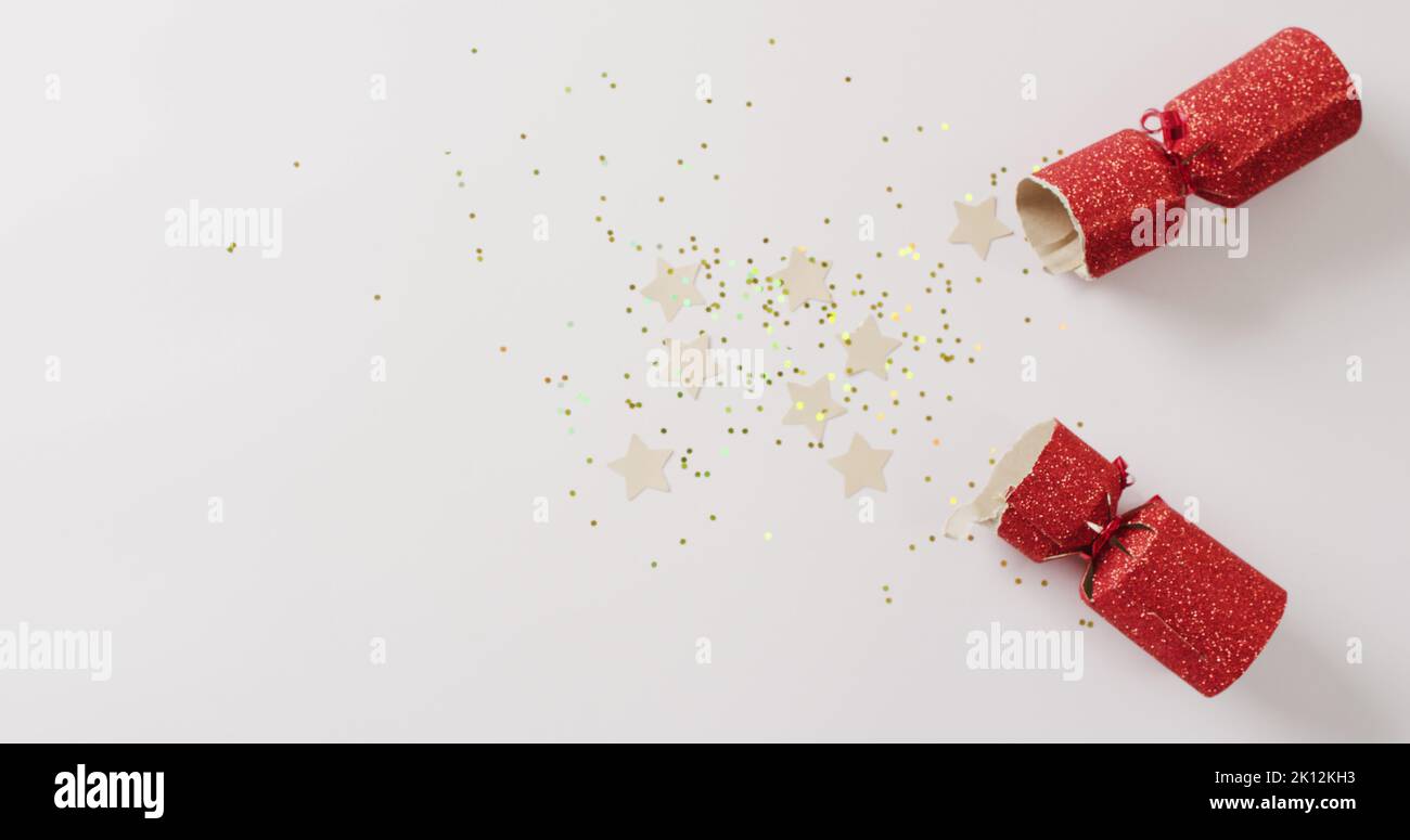 Image of red christmas cracker, stars and decoration with copy space on ...