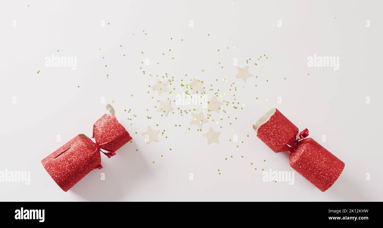 Image of red christmas cracker, stars and decoration with copy space on ...