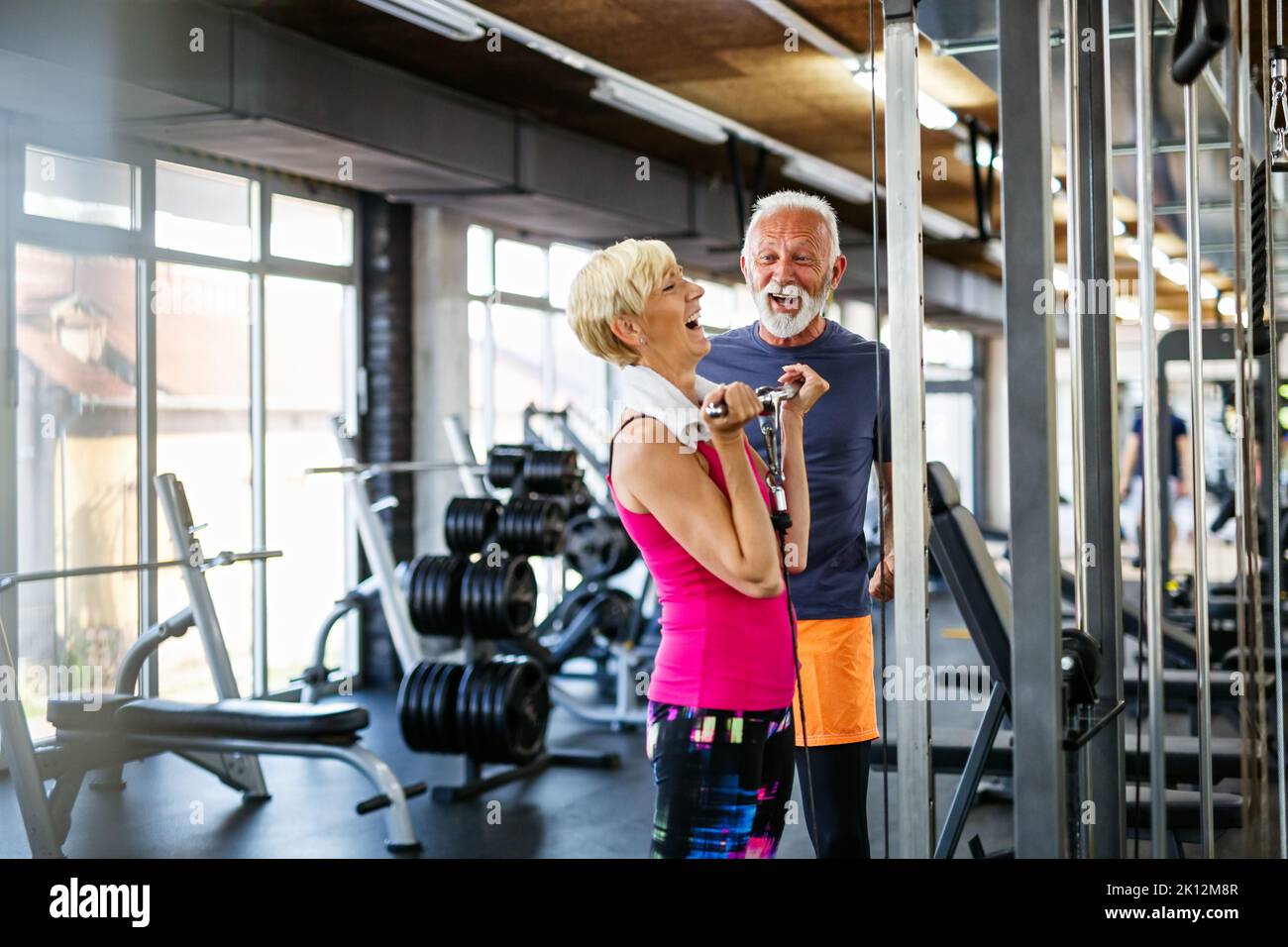 Happy senior people doing exercises in gym to stay fit. People sport ...