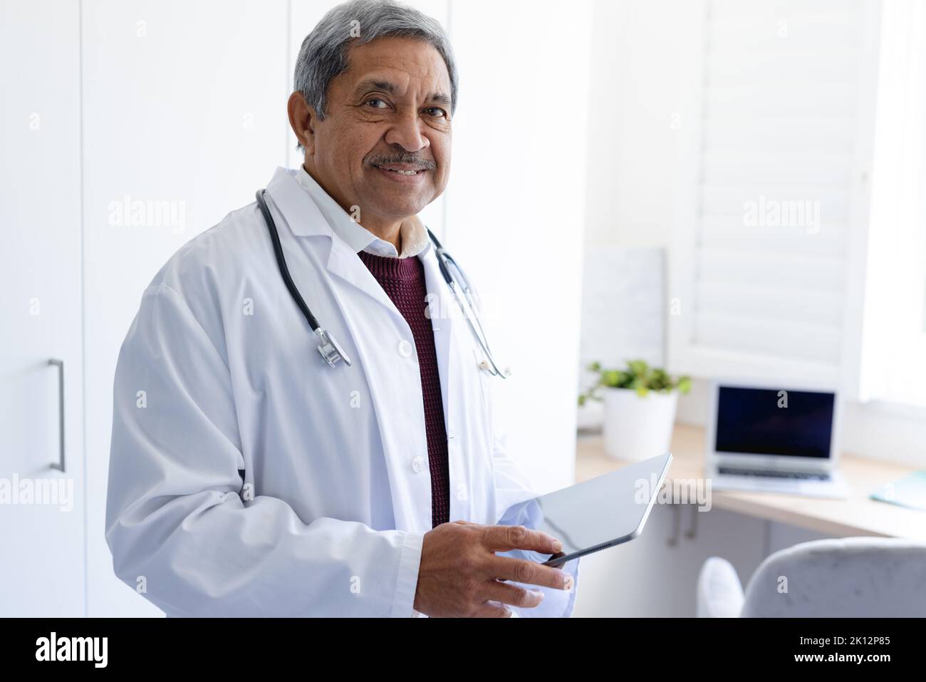 Senior biracial male doctor using hi-res stock photography and images ...