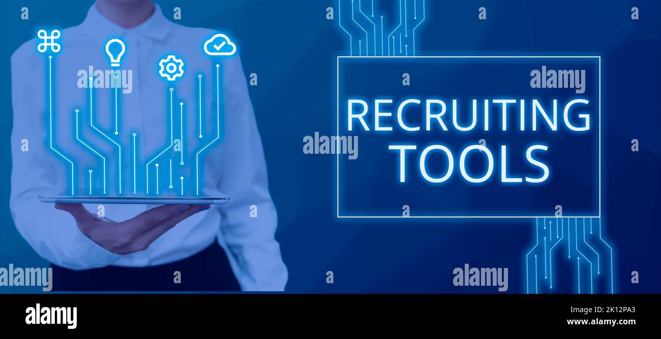 Hand writing sign Recruiting Toolsgetting new talents to your company ...