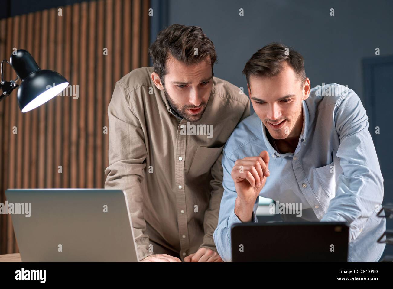 happy business colleagues, checking out the perfect solution for their ...