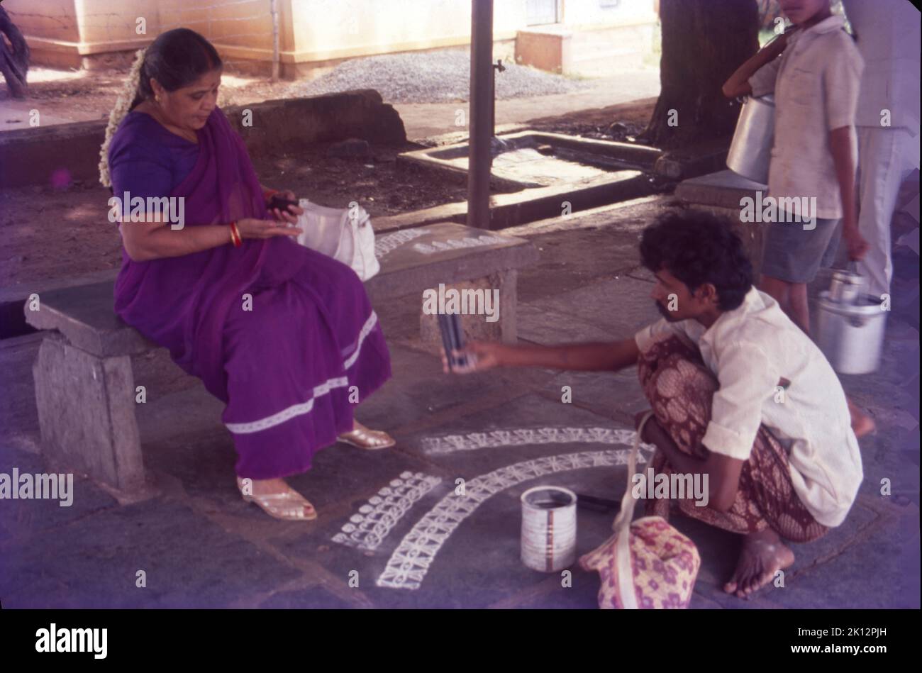 Tourist Buying Rangoli Instruments at Tirupati Temple Stock Photo - Alamy