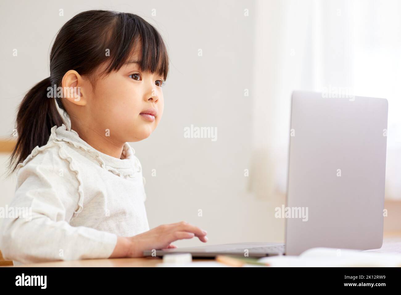 Japanese kid using laptop Stock Photo - Alamy