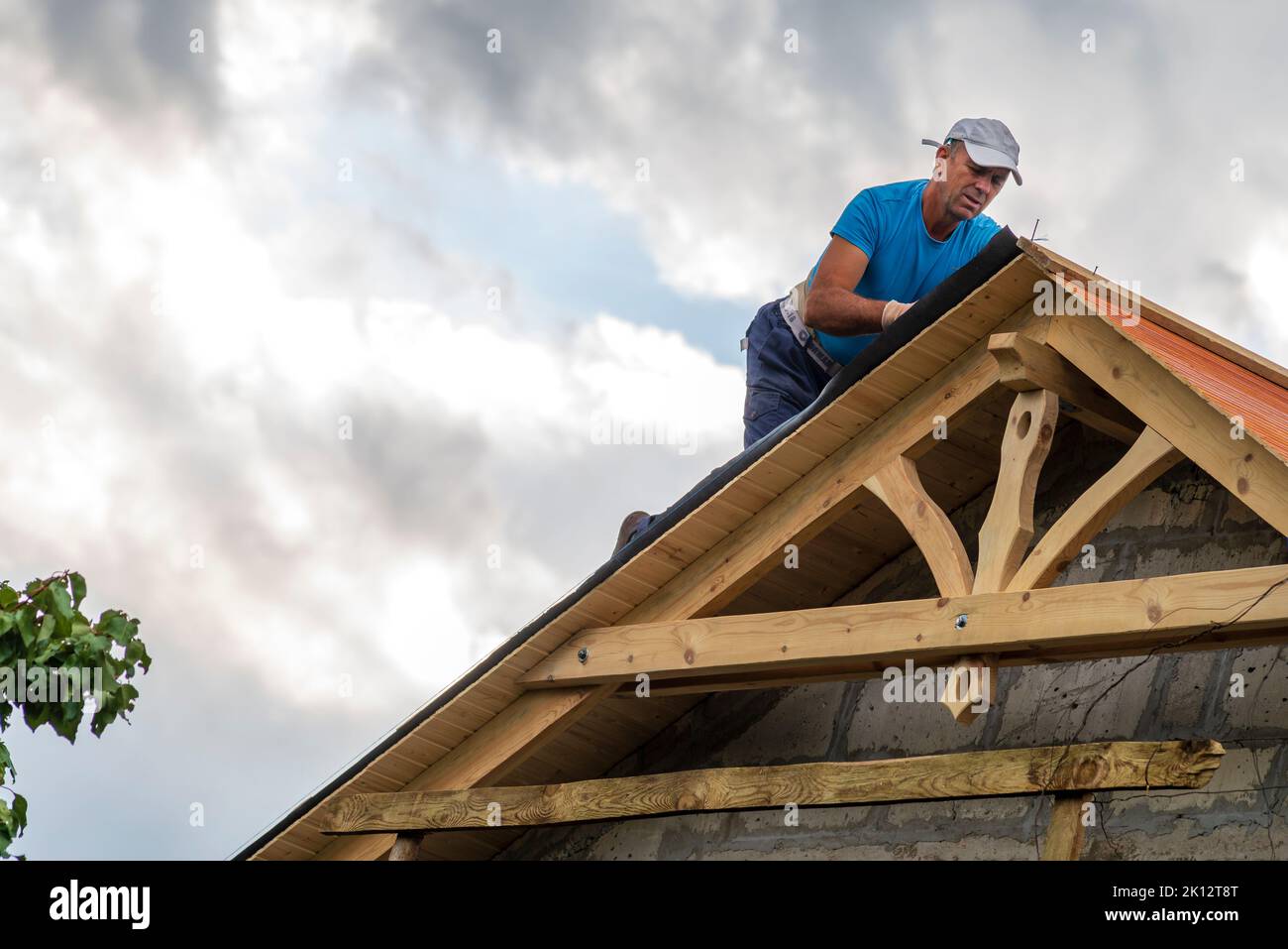 Roofer man roof carpenter working Country house renovation Stock Photo ...