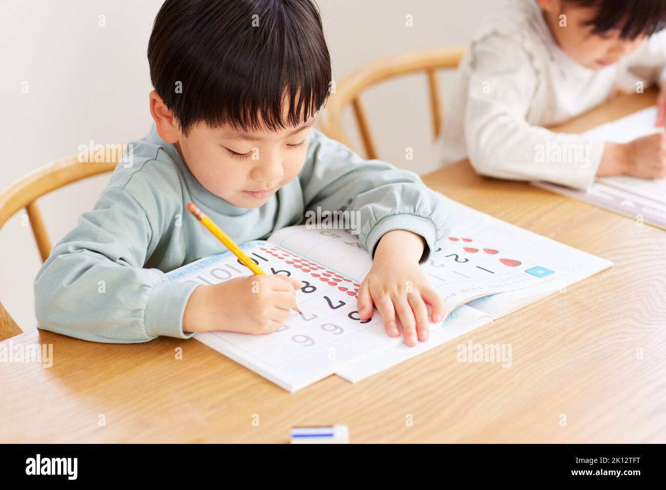 Brother sister studying together home hi-res stock photography and ...