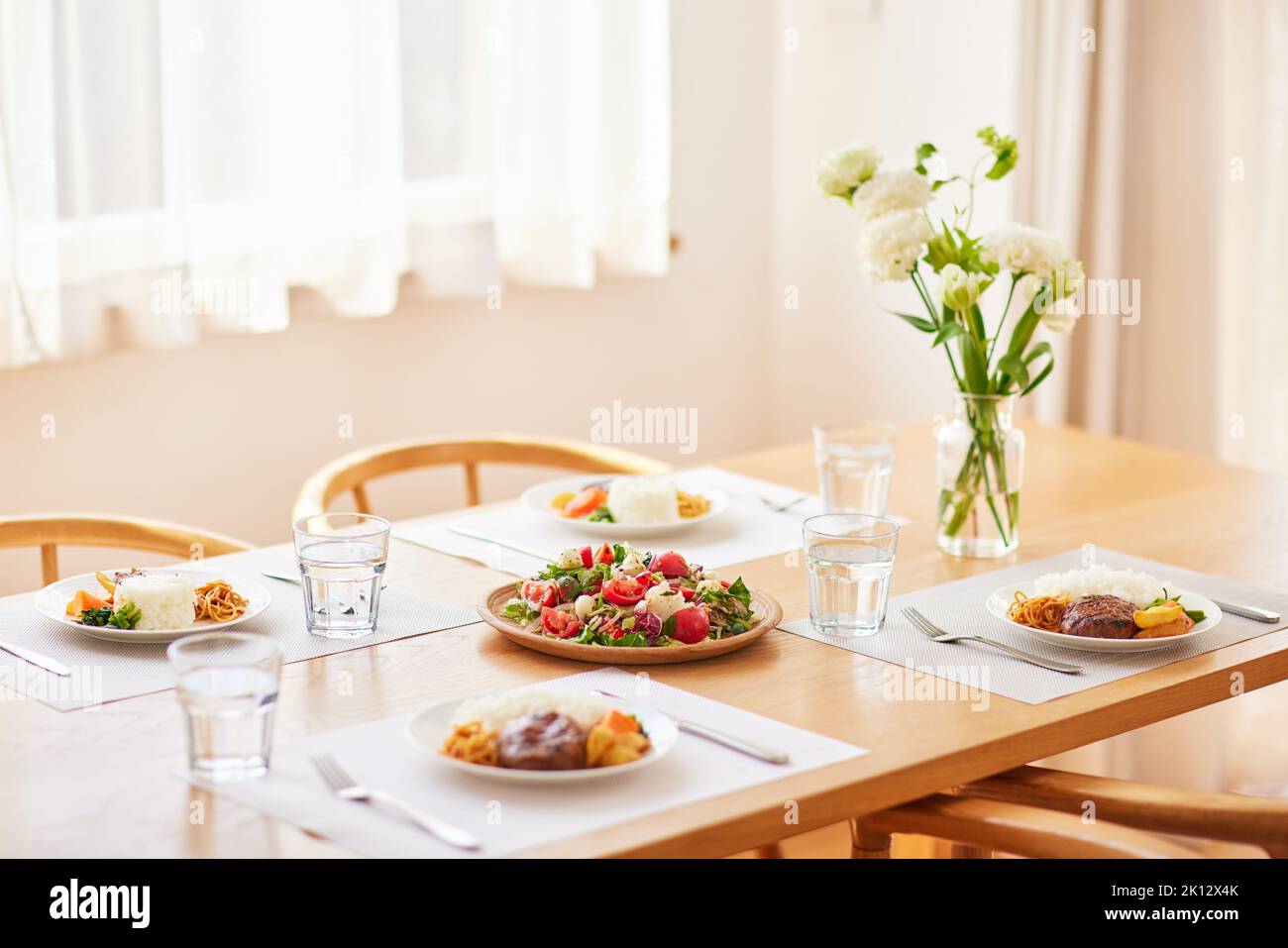 Delicious food on dining table Stock Photo - Alamy
