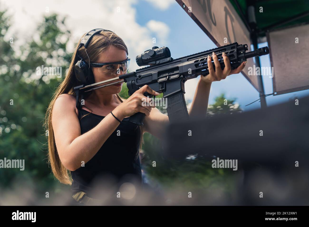 Woman aiming weapon hi-res stock photography and images - Alamy