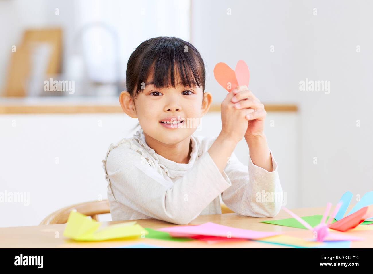 Japanese kid playing with origami at home Stock Photo - Alamy