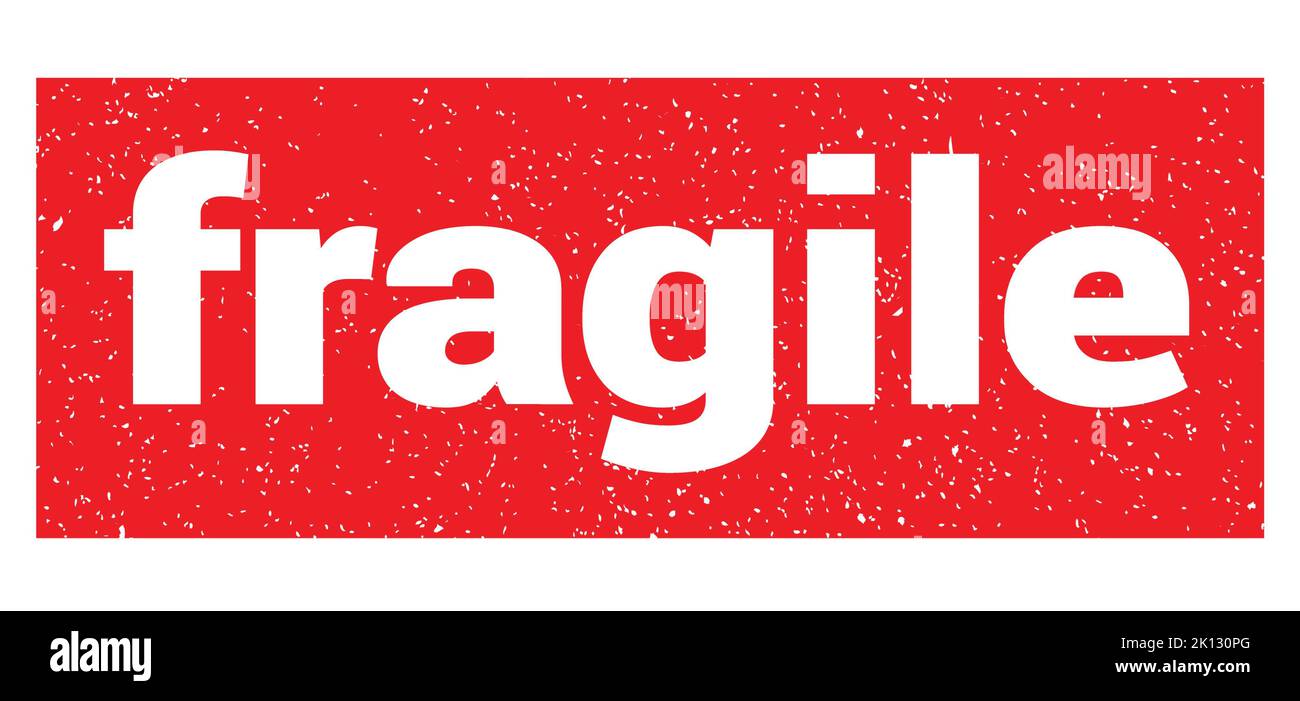 fragile text written on red grungy stamp sign Stock Photo - Alamy