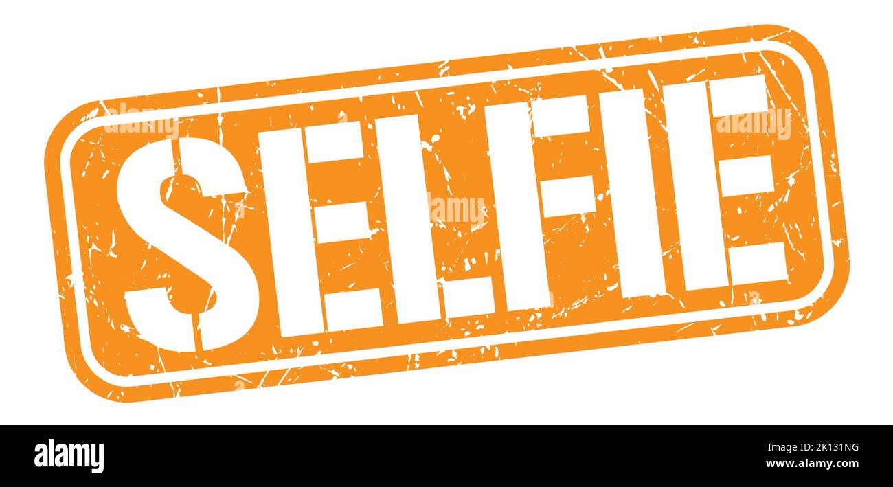 SELFIE text written on orange grungy stamp sign Stock Photo - Alamy