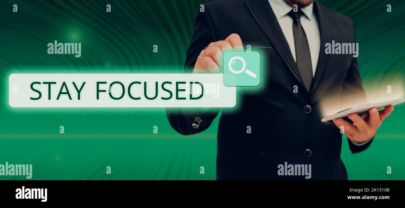 Writing displaying text Stay Focused. Business overview Be attentive Concentrate Prioritize the ...