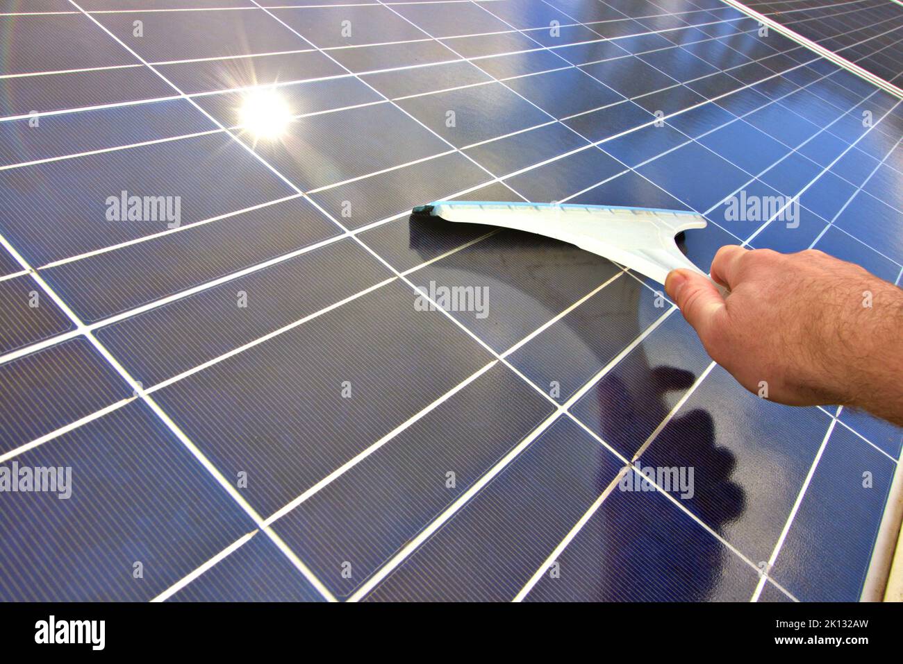 Hand cleaning solar panels Stock Photo - Alamy