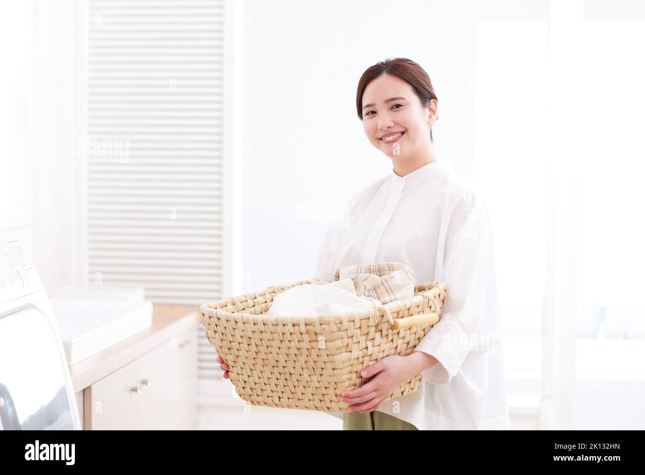 Japanese woman doing laundry at home Stock Photo - Alamy