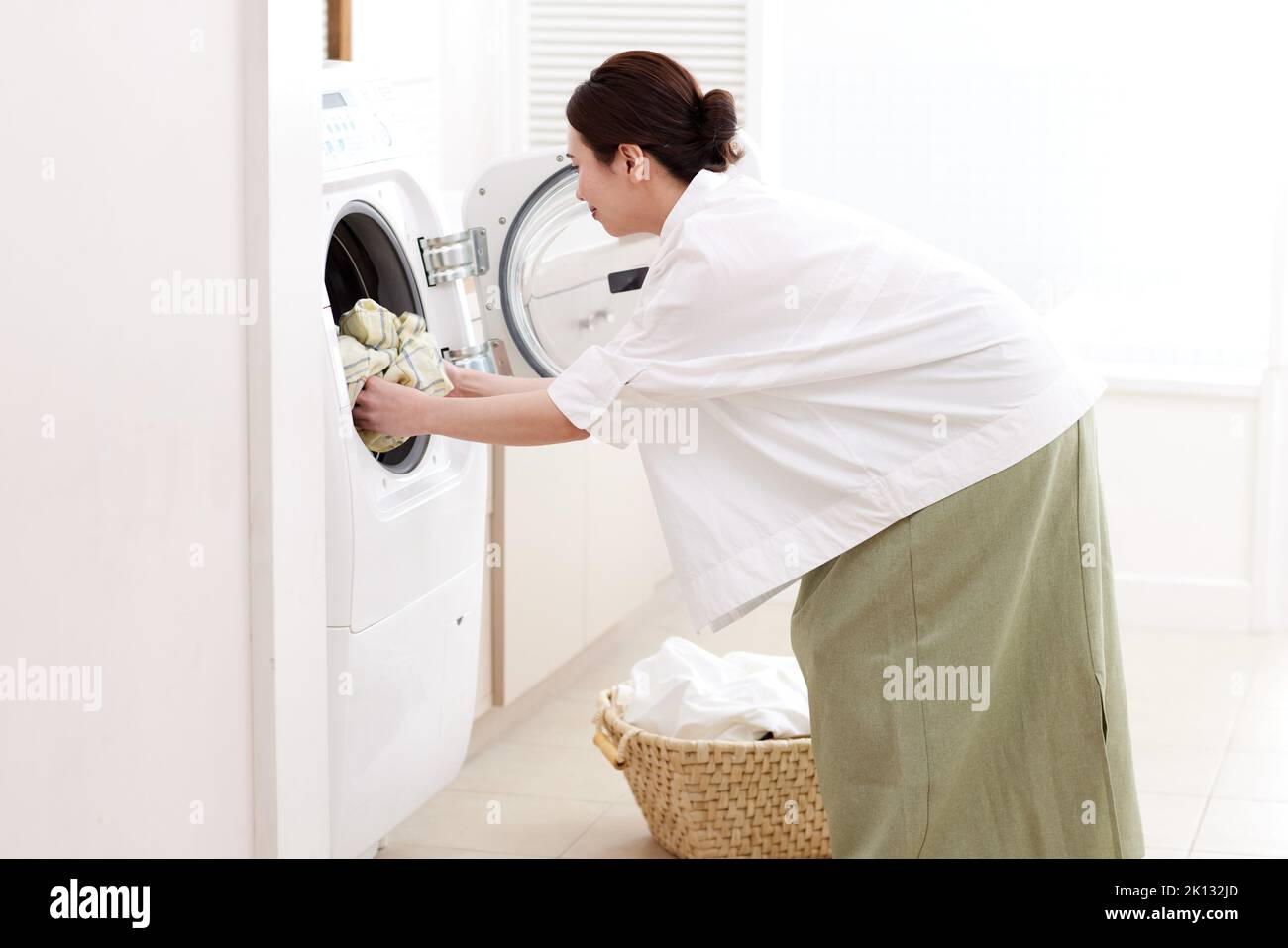 Japanese woman doing laundry at home Stock Photo - Alamy