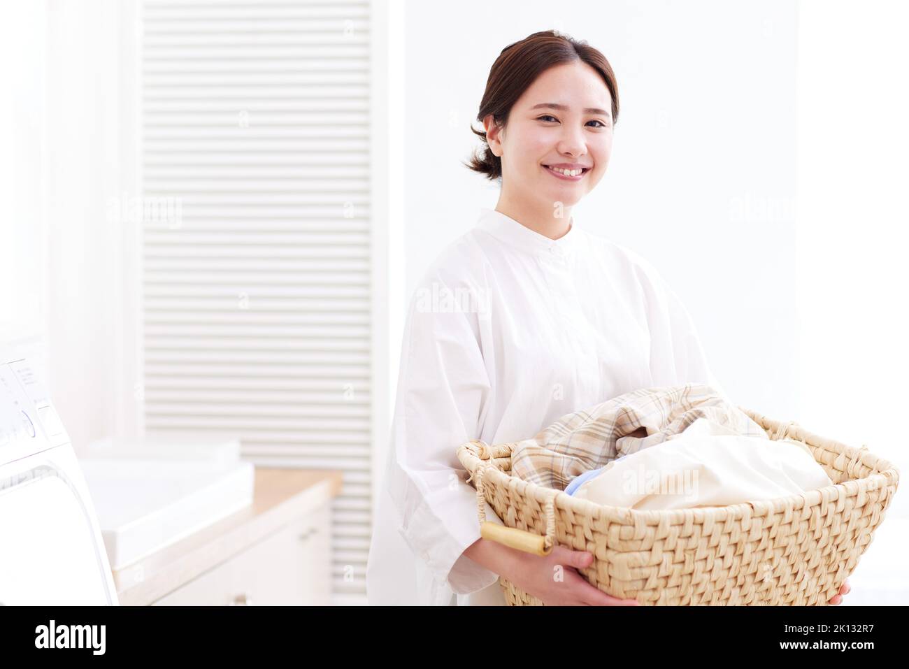 Japanese woman doing laundry at home Stock Photo - Alamy