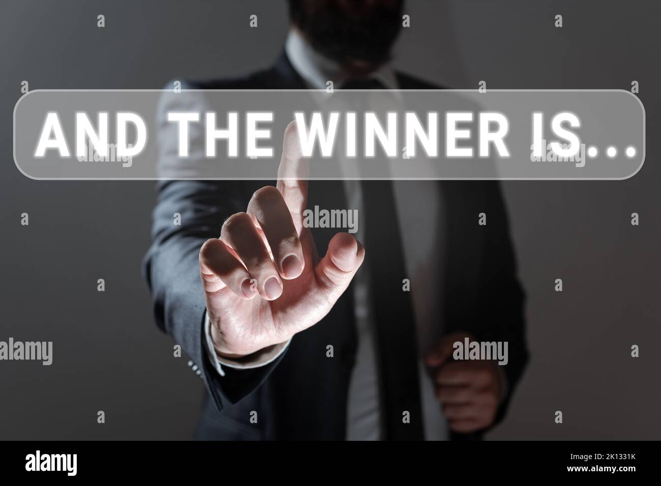 Hand writing sign And The Winner Is.... Internet Concept Announcing who ...