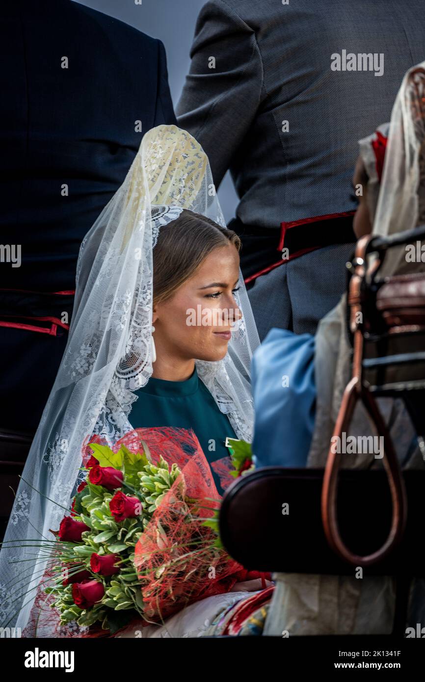 Goya's ladies in a horse drawn carriage, traditionally dressed, wearing ornate dresses and ...