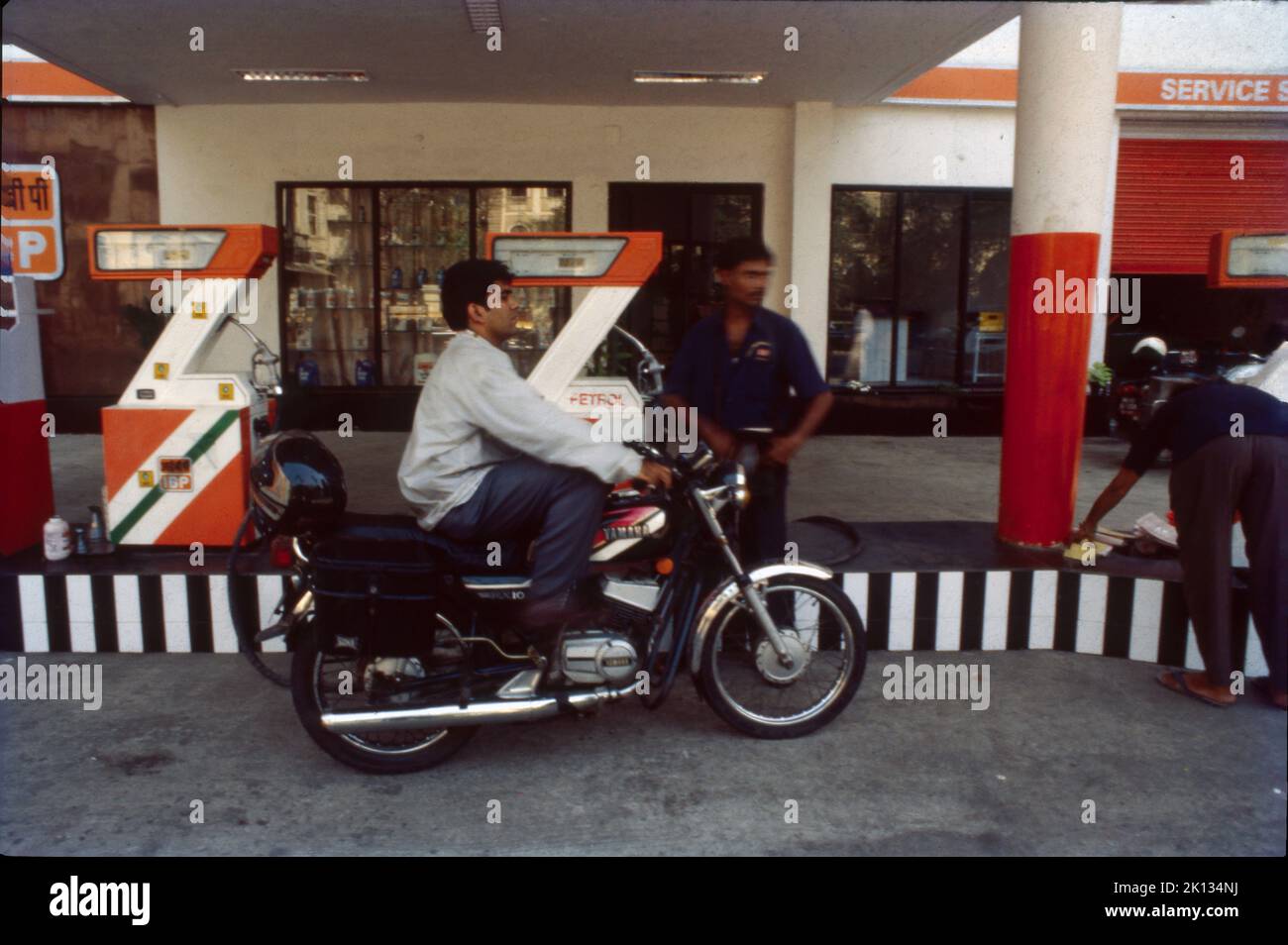 Motor Cycle getting Fuel, Bombay, India Stock Photo - Alamy
