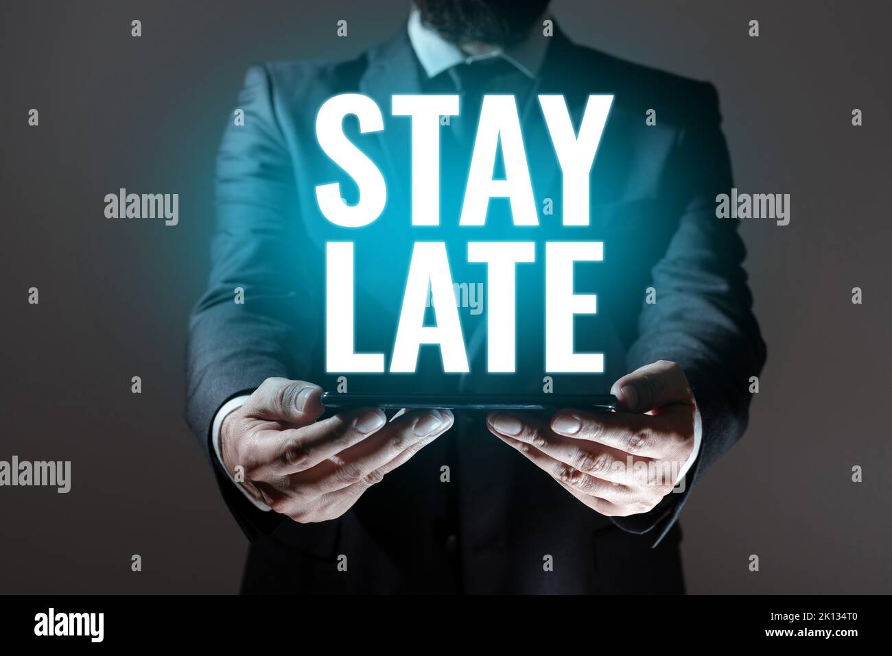 Sign displaying Stay Late. Concept meaning A routine in which a person ...