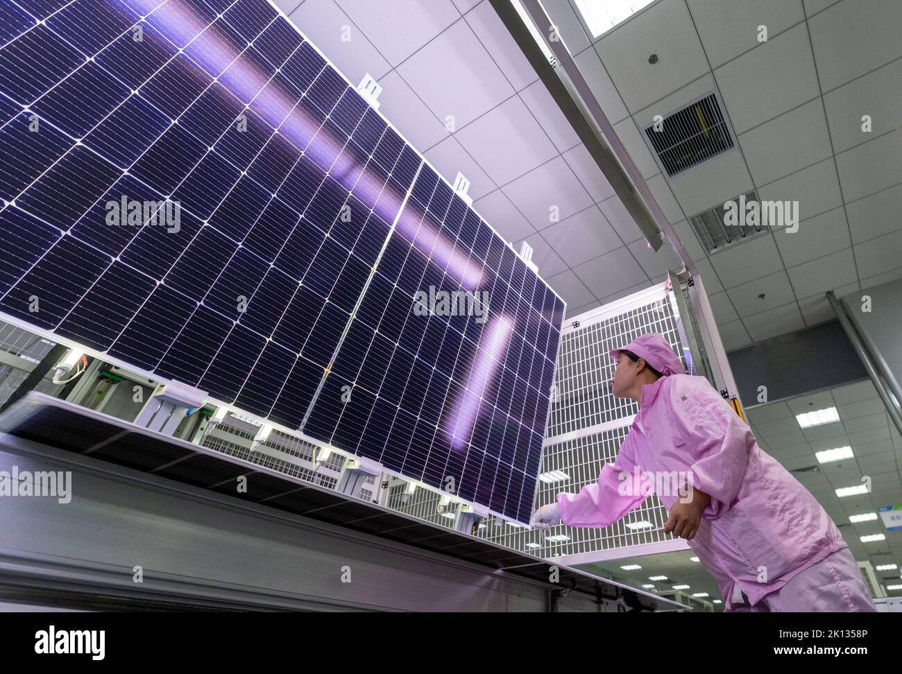 HEFEI, CHINA - SEPTEMBER 15, 2022 - A worker produces solar ...