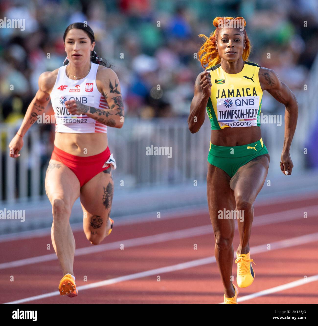 Ewa Swoboda of Poland and Elaine Thompson-Herah of Jamaica competing in ...