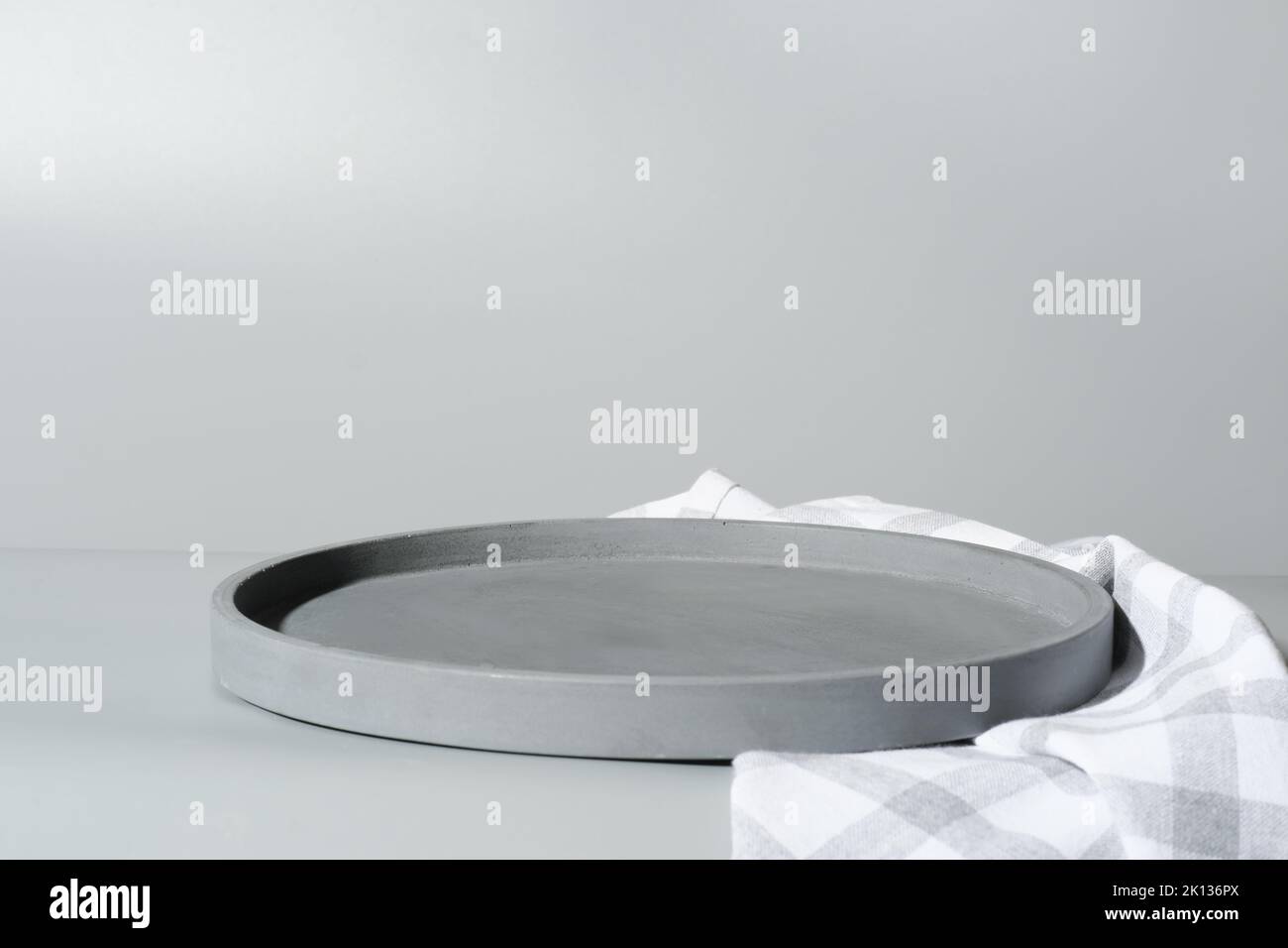 grey concrete tray made of cement as stand under plate. empty scene for ...