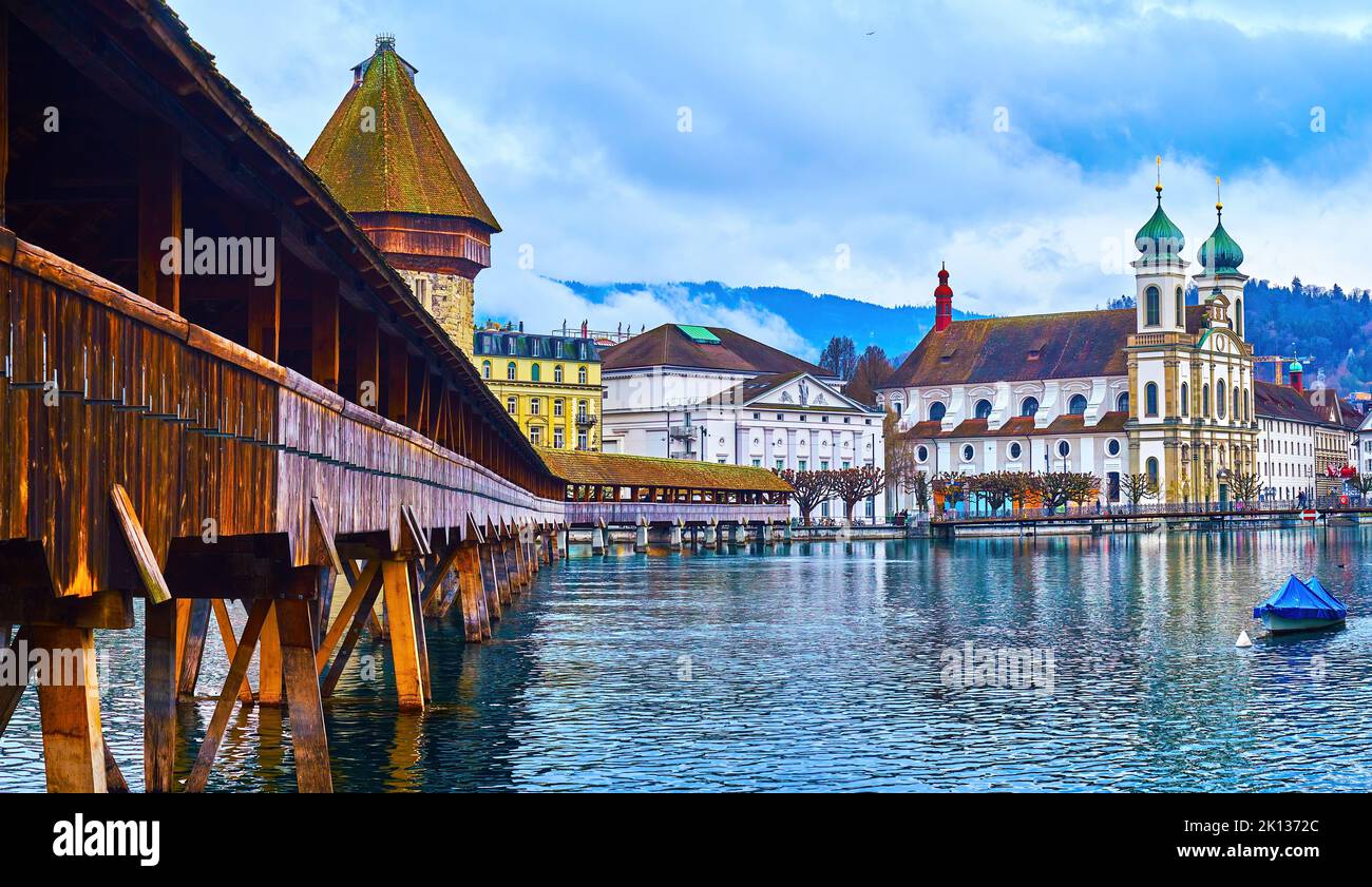 Kapellbrucke, the wooden medieval bridge across Reuss river, and the ... Kapellbrucke, the wooden medieval bridge across Reuss river, and the ...