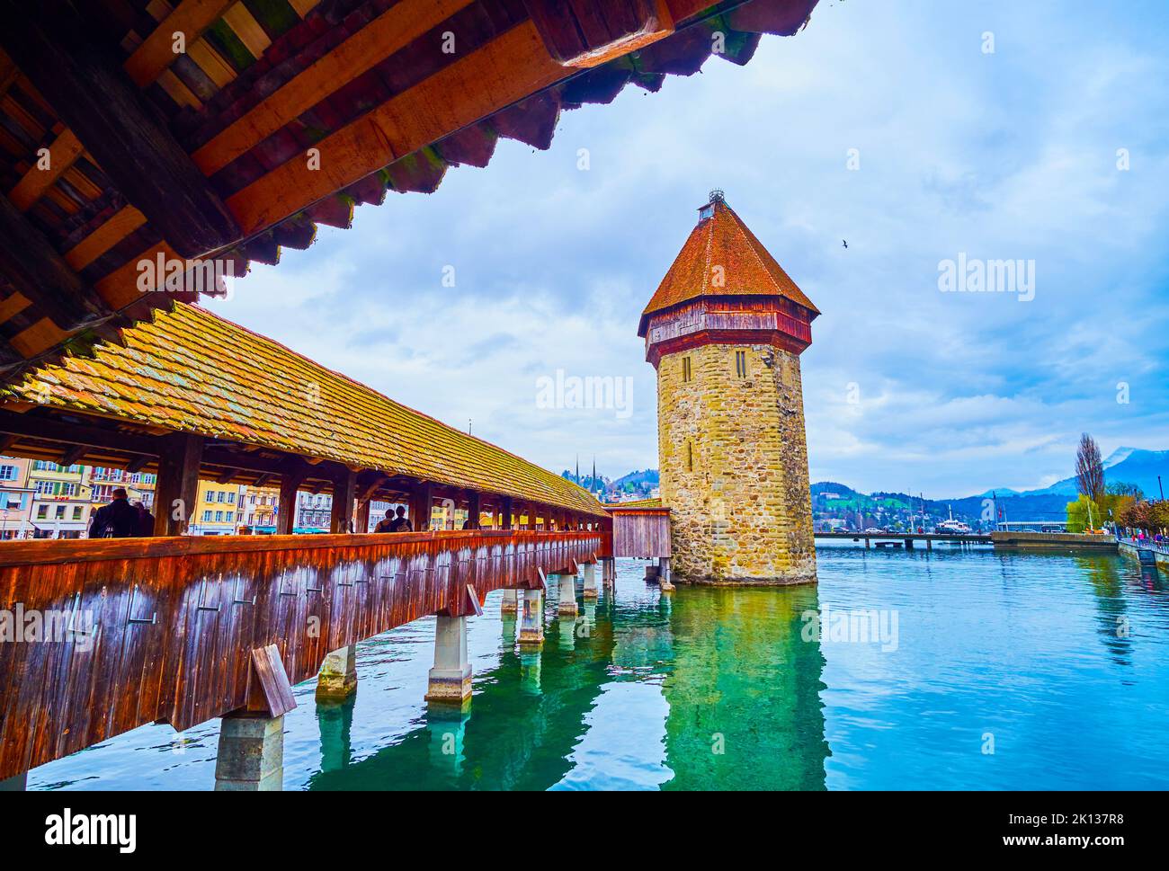 Walk along medieval covered wooden Kapellbrucke (Chapel Bridge) in ...