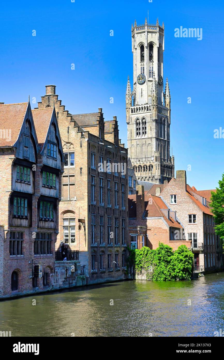 Famous canal of Rozenhoedkaai and the Belfry in the background, Bruges ...