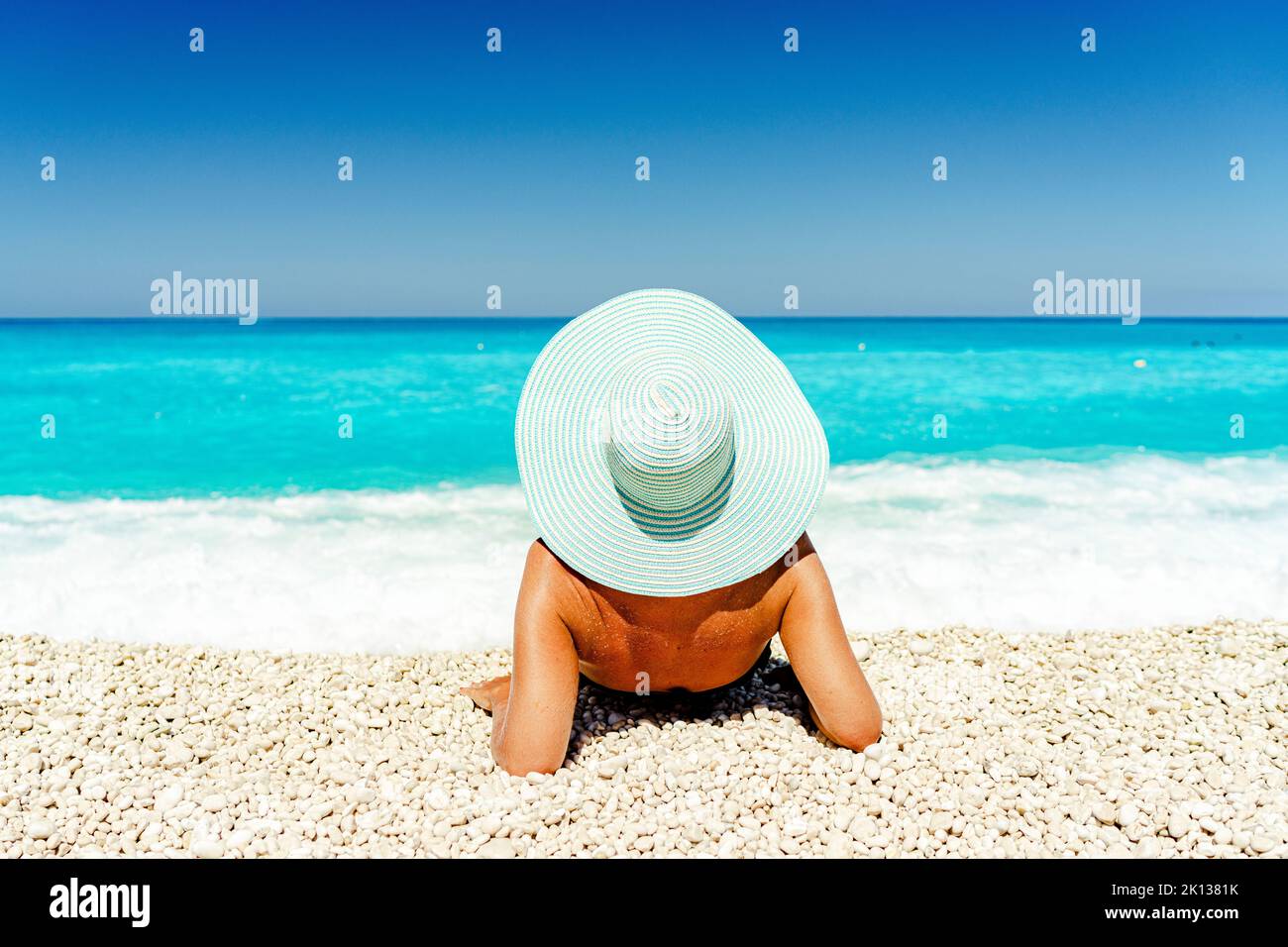 Greece beach sunbathing woman hi-res stock photography and images - Alamy