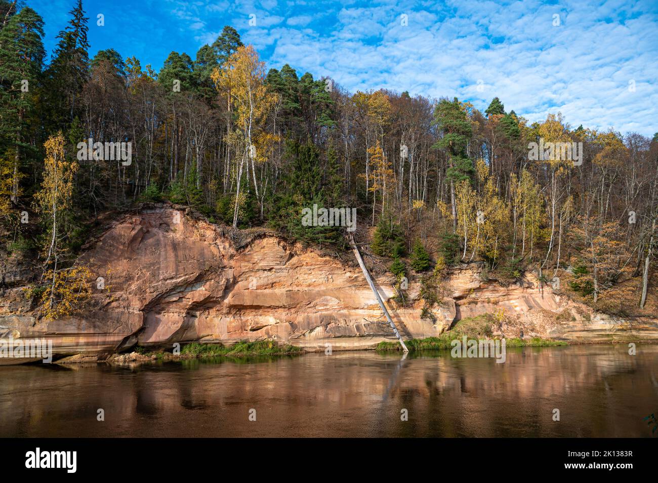 Devils rock and cave by the shores of the River Gauja, surrounded by a ...