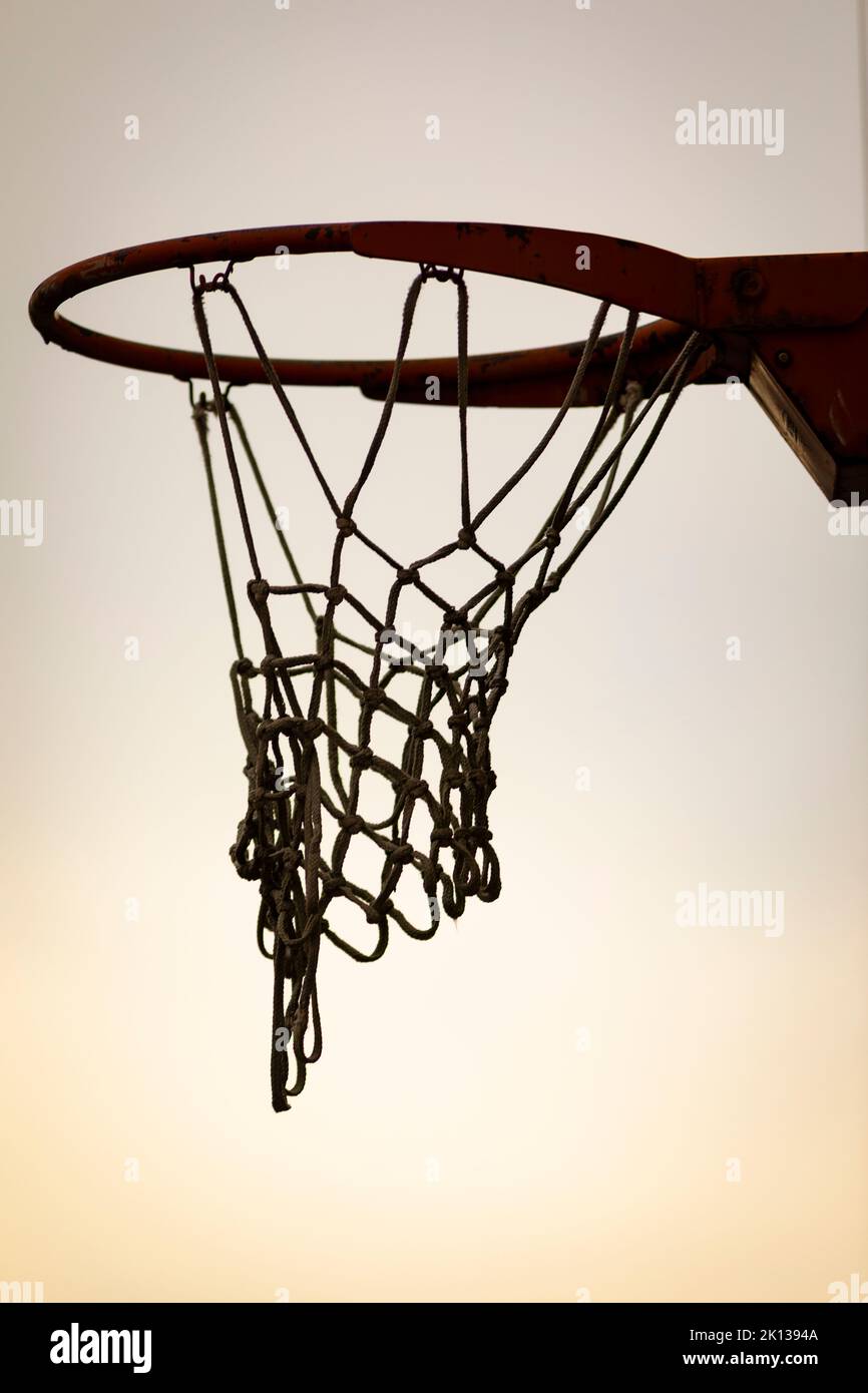 Outdoor basketball hoop at sunset. Playground Stock Photo - Alamy