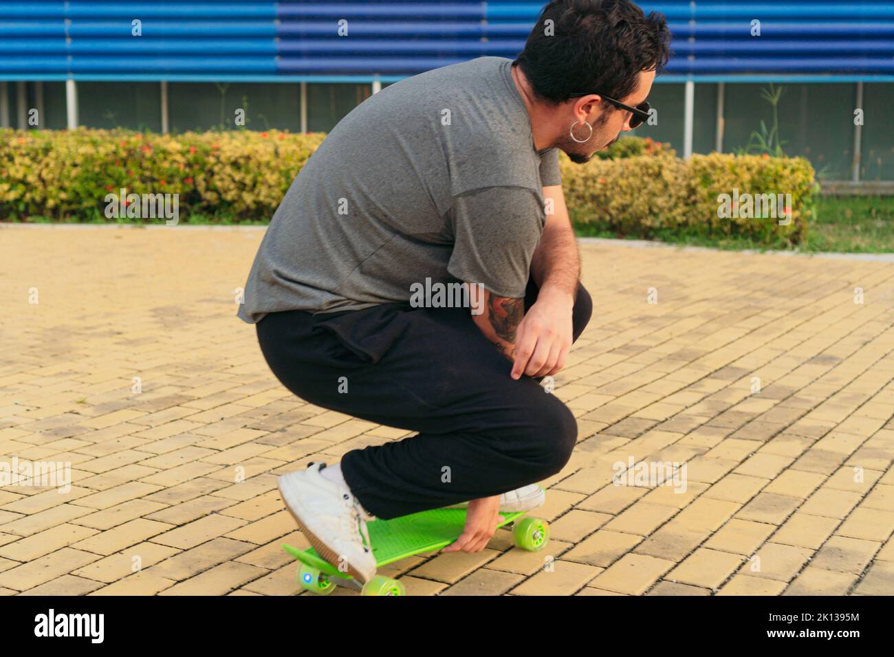 Man tricks on skateboard in hi-res stock photography and images - Alamy