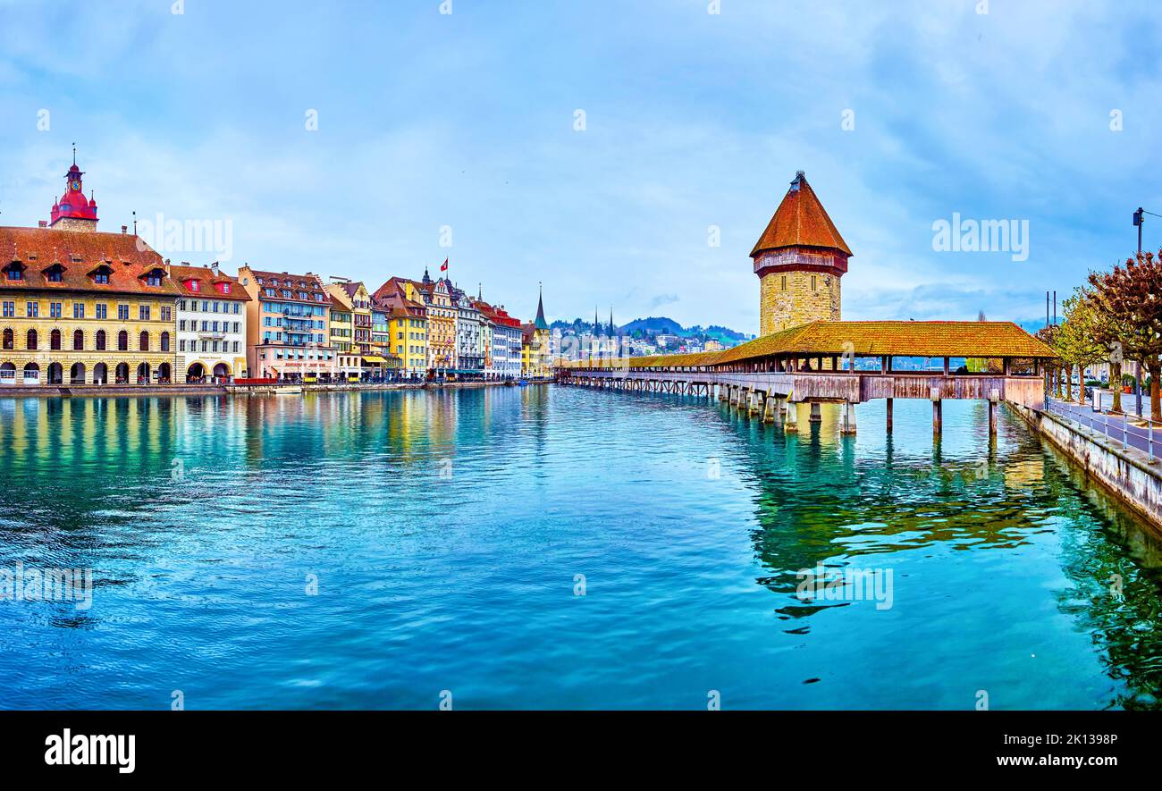 LUCERNE, SWITZERLAND - MARCH 30, 2022: Walk along the bank of Reuss ...