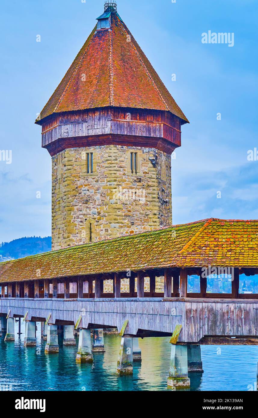 Medieval Kapellbrucke wooden bridge and Wasserturm tower, the main ...