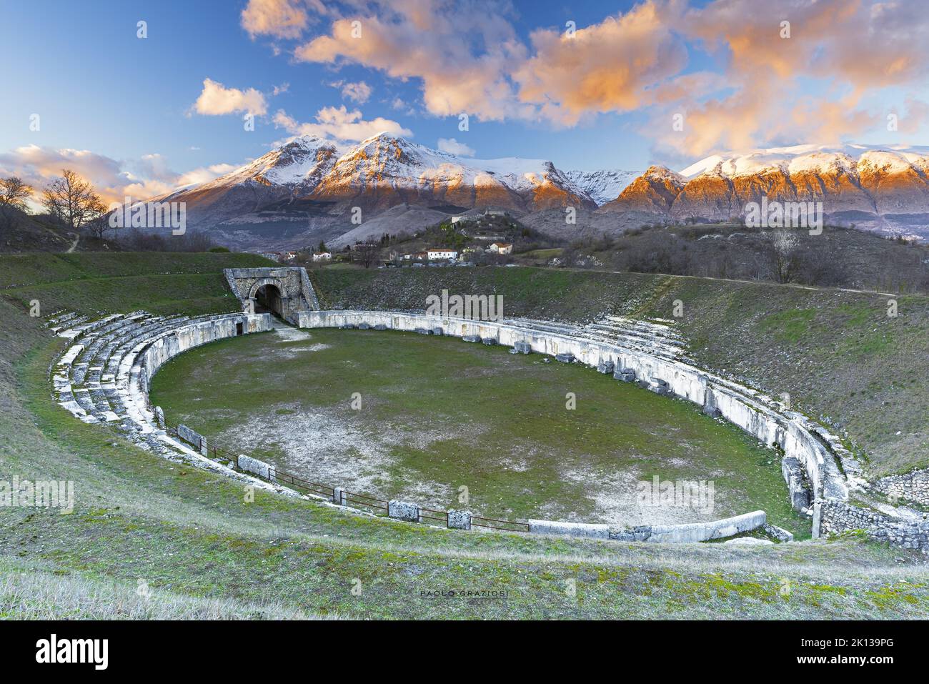 Sunset from the amphitheatre of the Roman site of Alba Fucens with snow ...