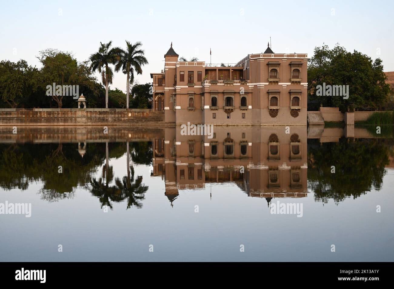 Sri Joravar Vilas reflected in the still waters of the lake, swallows ...