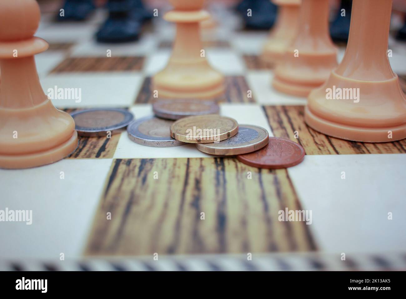 euro coins on the chessboard with the concept of financial doubts about ...