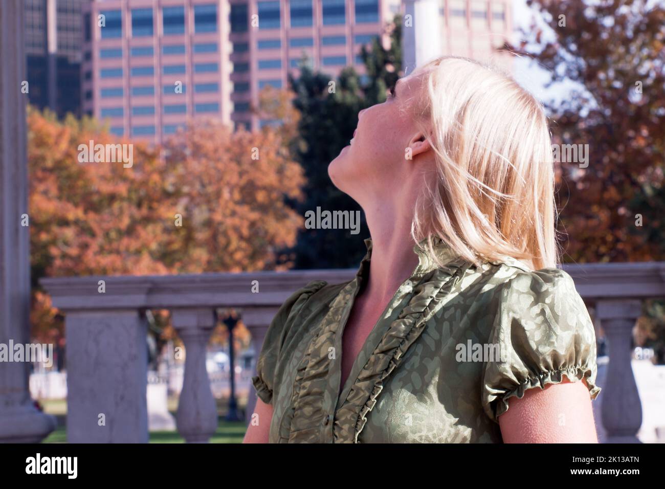 Woman looking around Stock Photo - Alamy