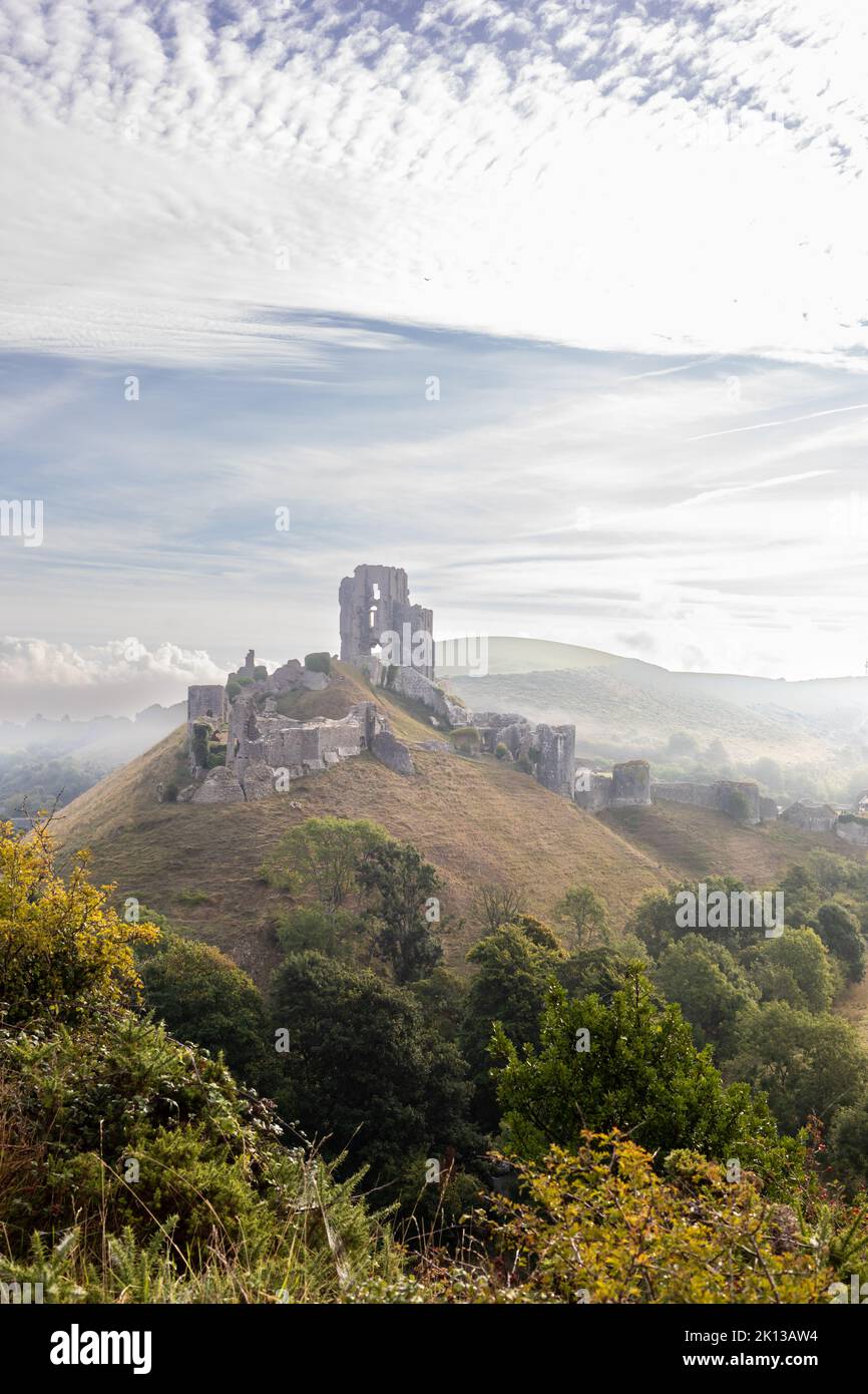View of Corfe Castle in the Isle of Purbeck, Dorset, England on a misty ...
