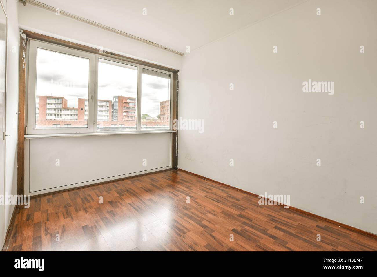 Interior of empty modern apartment with geometric panoramic windows and ...