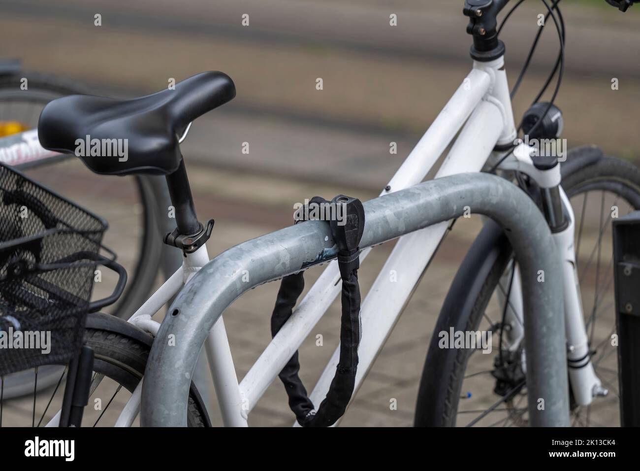 A bicycle secured with a bicycle lock Stock Photo - Alamy