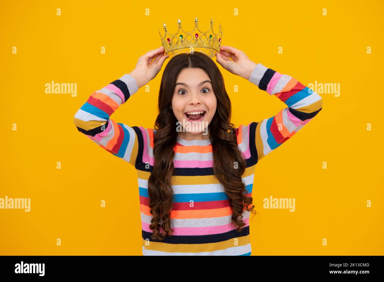 Amazed teenager. Little queen wearing golden crown. Teenage girl ...