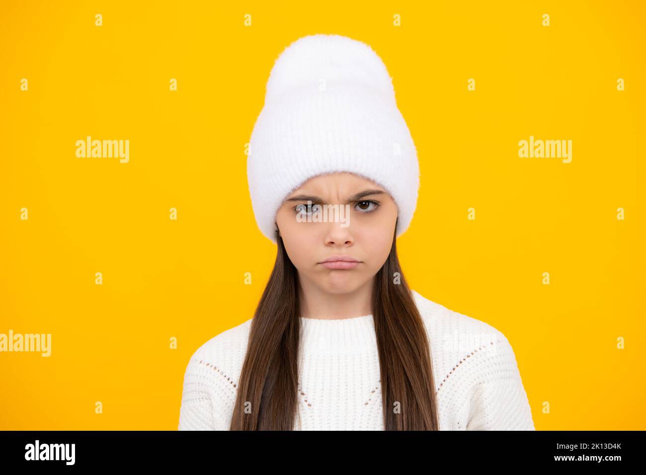 Angry teen girl. Child looking at camera with hate and rage negative ...