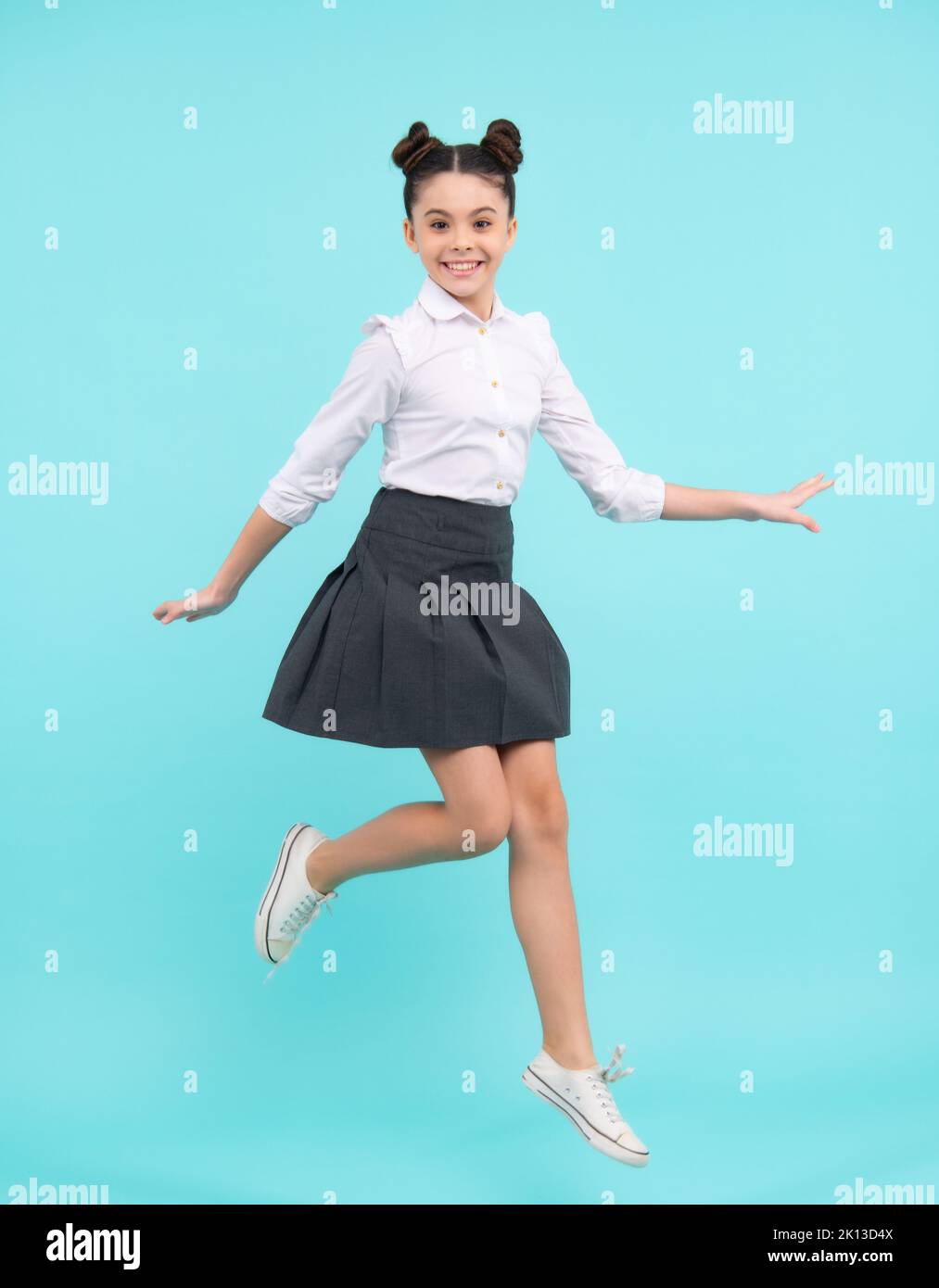 Funny excited jumping teenager. Happy schoolgirl, positive and smiling ...