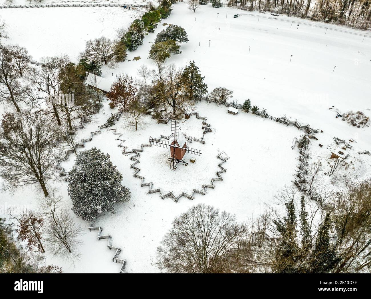 A drone view of a windmill in a snow-covered park Stock Photo - Alamy