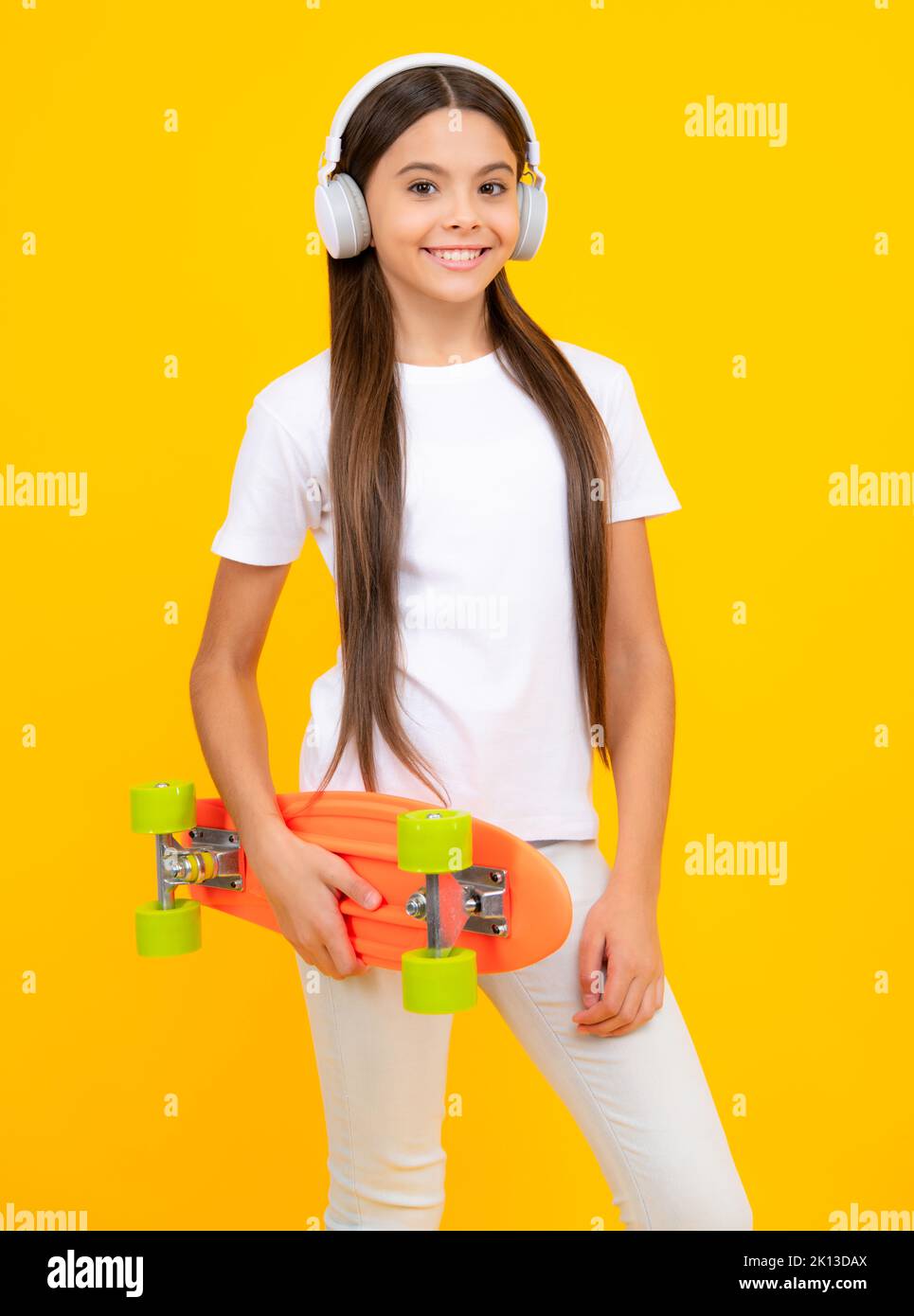 Happy teenager portrait. Studio shot of trendy teenage fashion model in ...