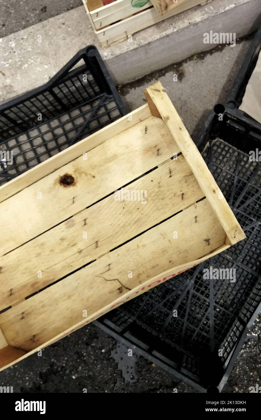 A vertical top shot of wooden and plastic empty food boxes Stock Photo ...